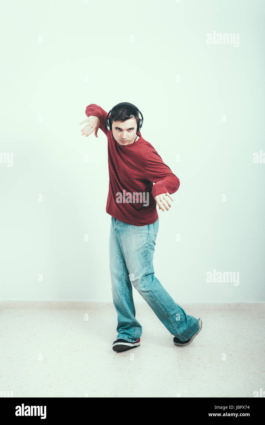 Young man with headphones dancing Stock Photo - Alamy