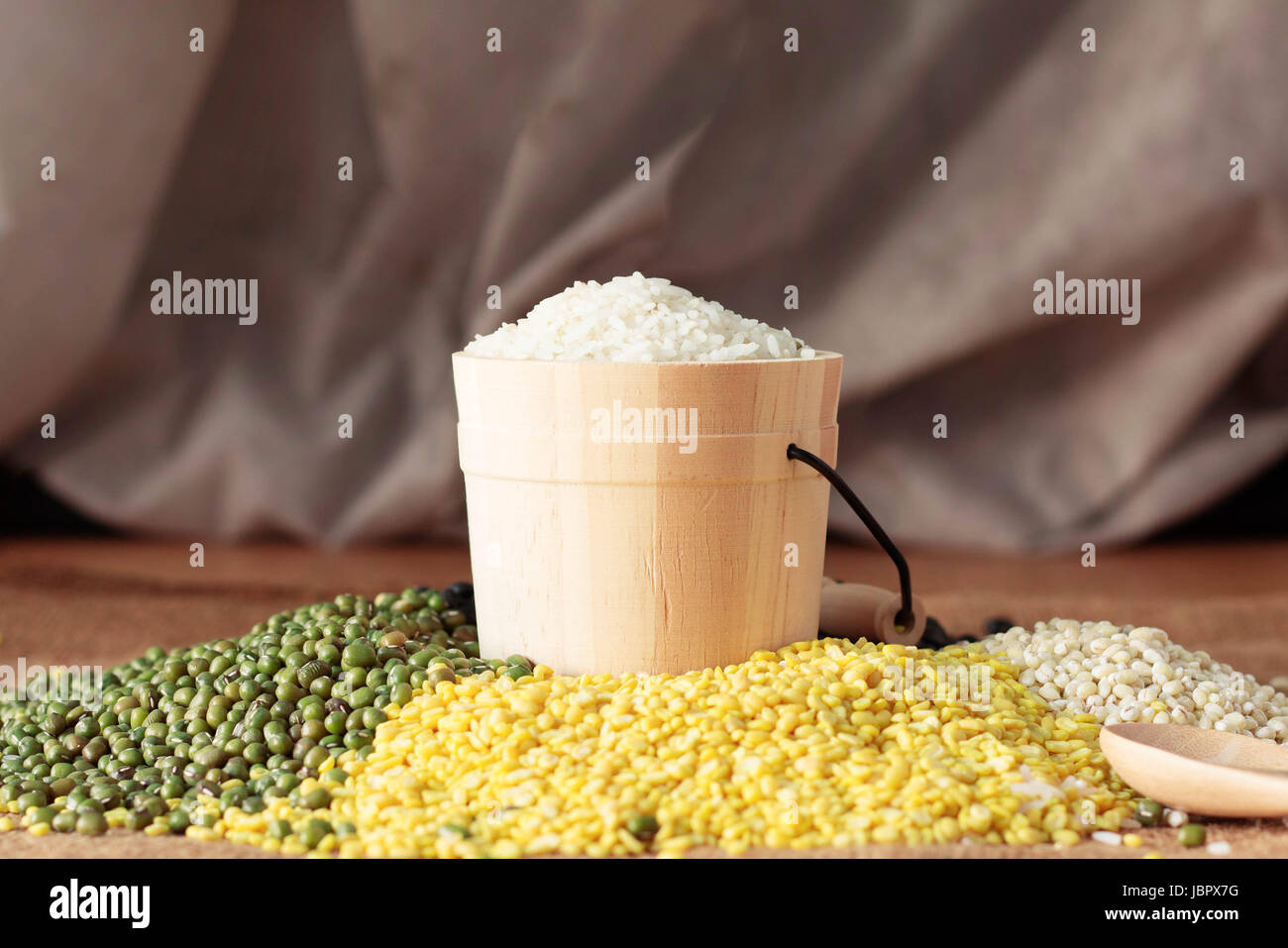 bucket of rice and many nuts on the table top Stock Photo - Alamy