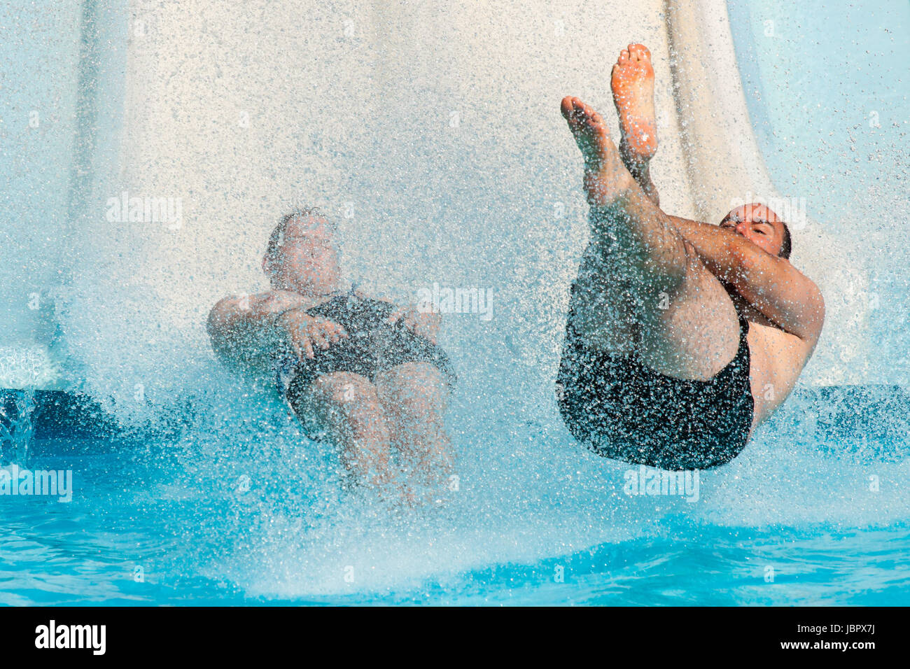 People having fun, sliding at water park Stock Photo - Alamy