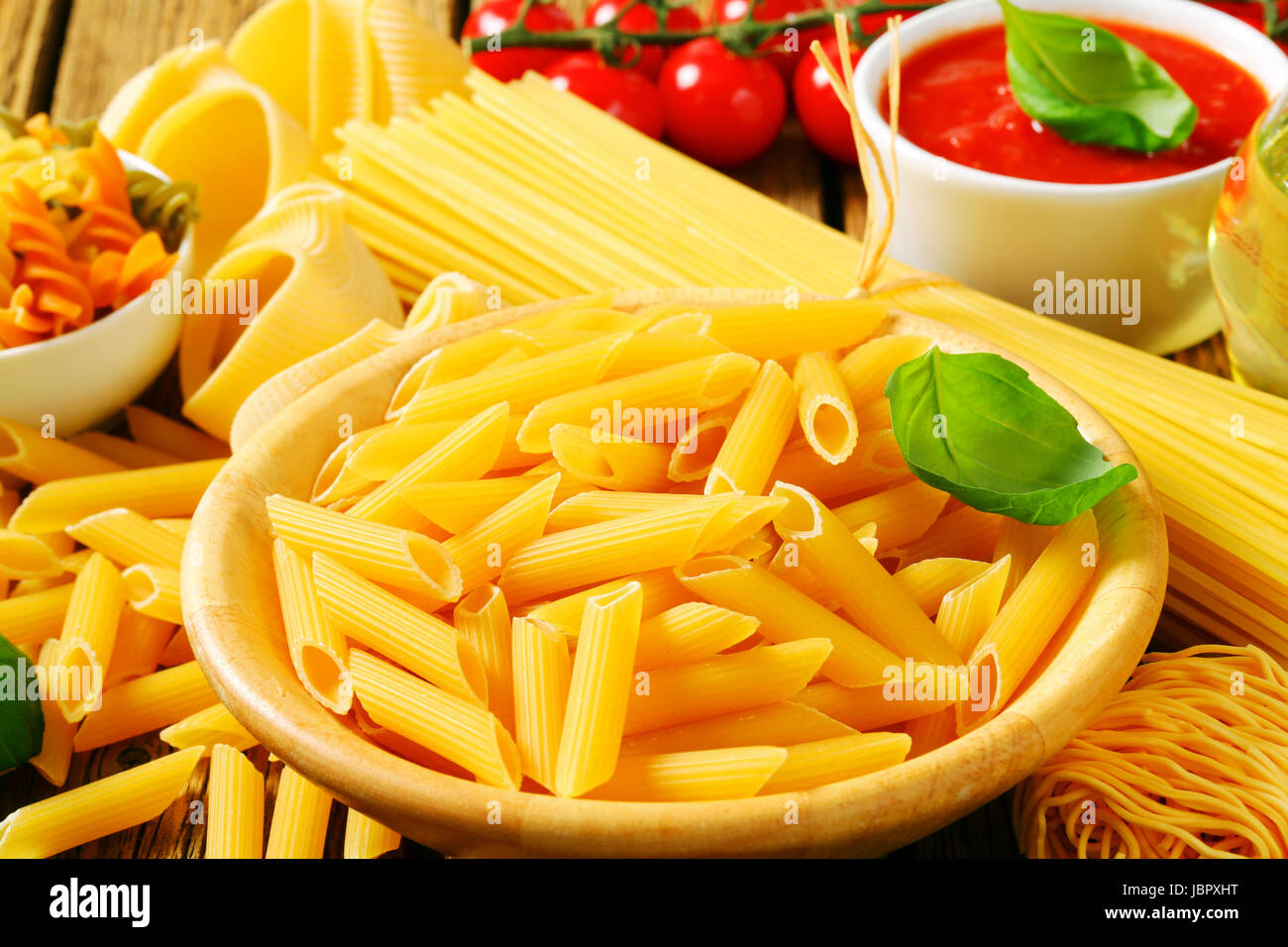 Assorted pasta and tomato puree Stock Photo - Alamy