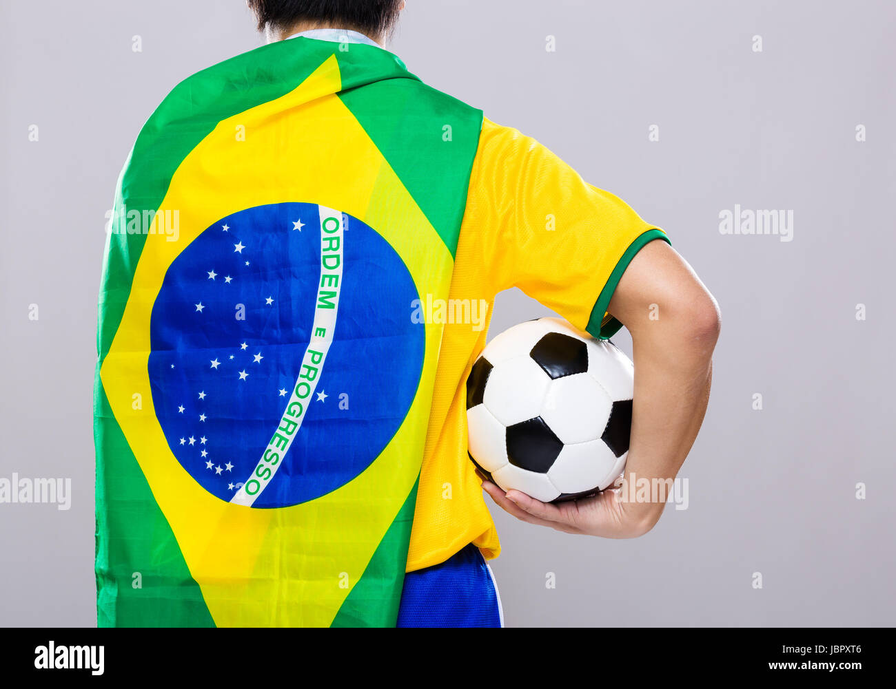 Man with Brazil flag and hold soccer ball Stock Photo - Alamy