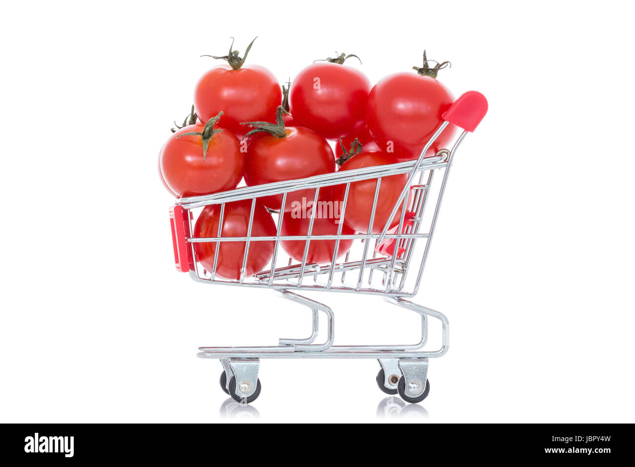 Tomatoes in shopping cart isolated on white background Stock Photo - Alamy