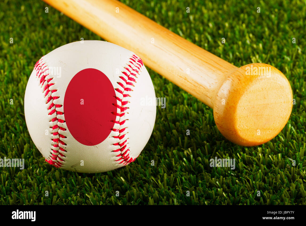 Baseball with Japan flag and bat over a background of green grass Stock ...