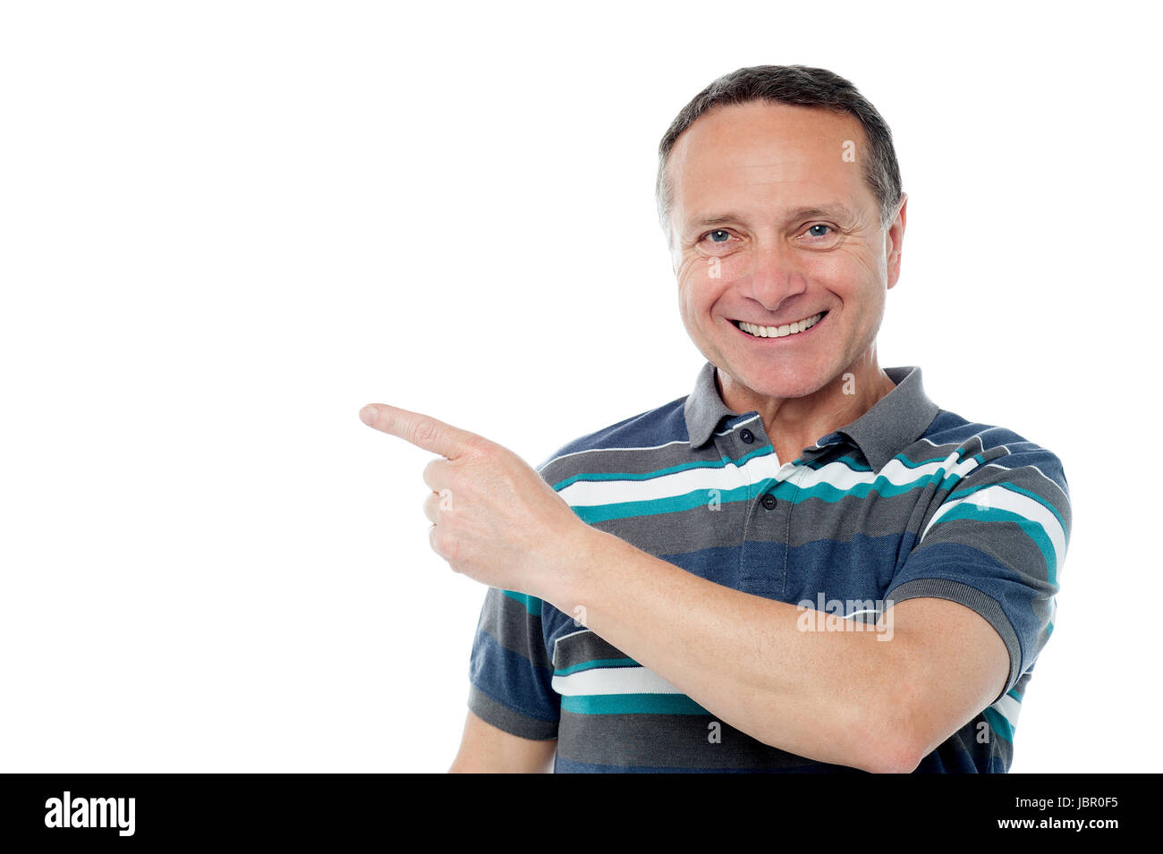 Smiling man pointing his finger towards something Stock Photo - Alamy