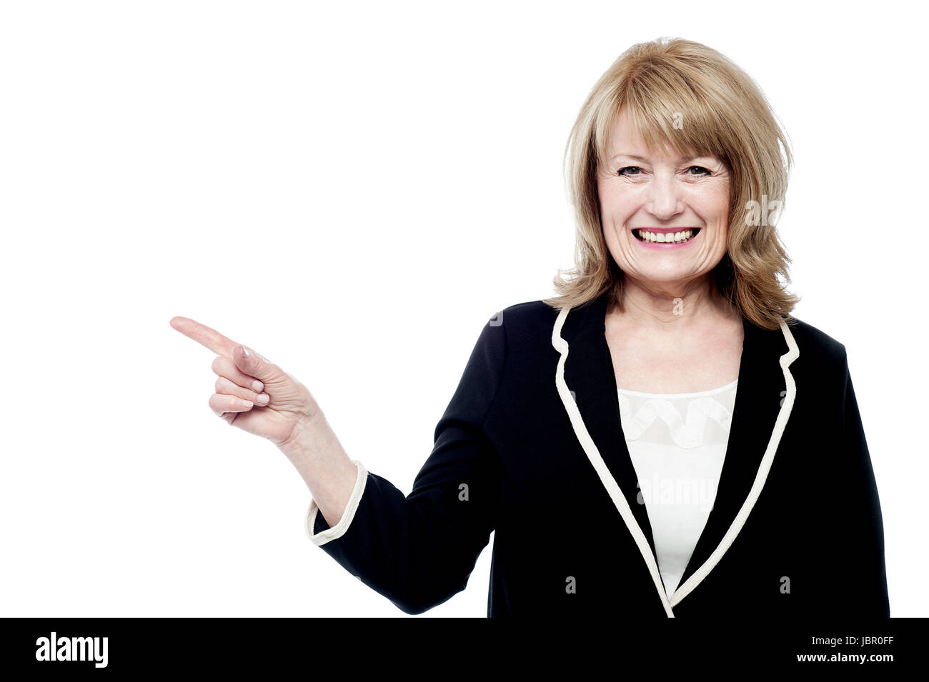 Cute smiling lady model pointing away Stock Photo - Alamy