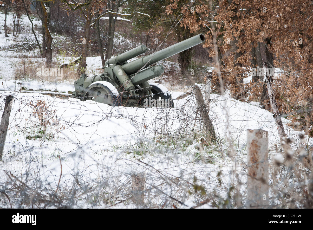 Defence line artillery sitting idle in winter snow Stock Photo - Alamy