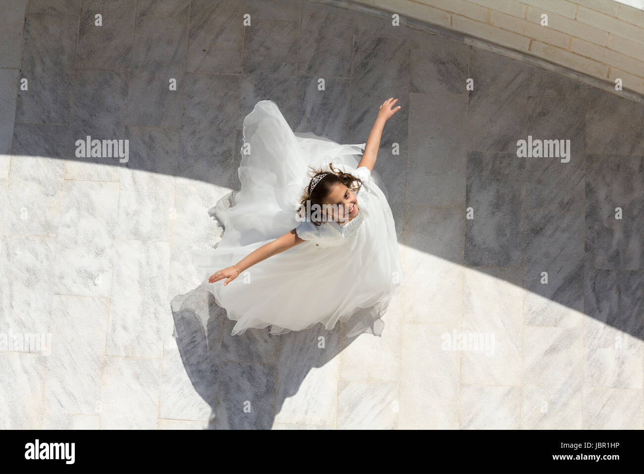 A young girl celebrating her First Holy Communion Stock Photo - Alamy