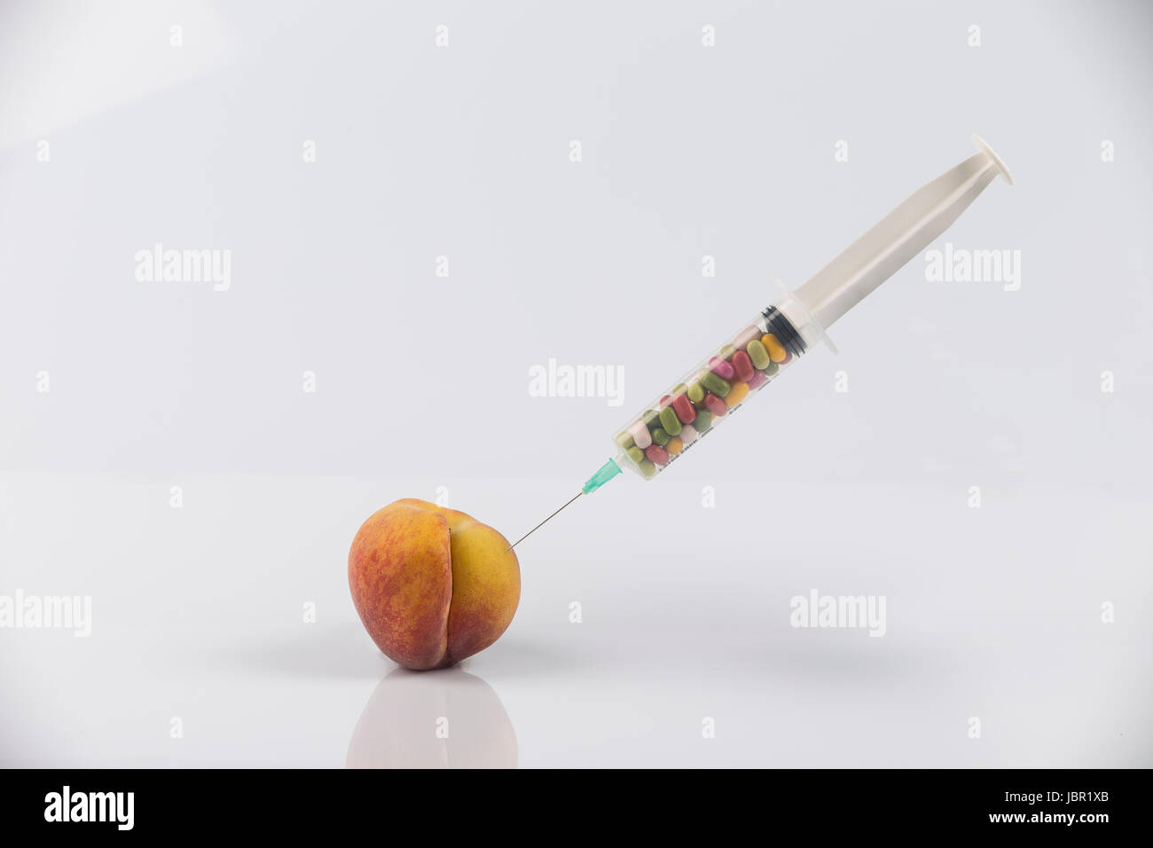 Female menopause and sexual disease metaphor: peach and syringe with ...