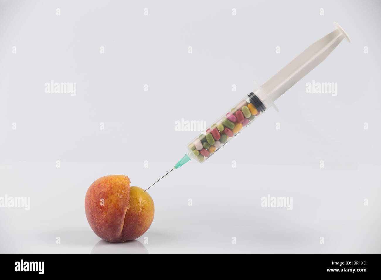 Female menopause and sexual disease metaphor: peach and syringe with ...