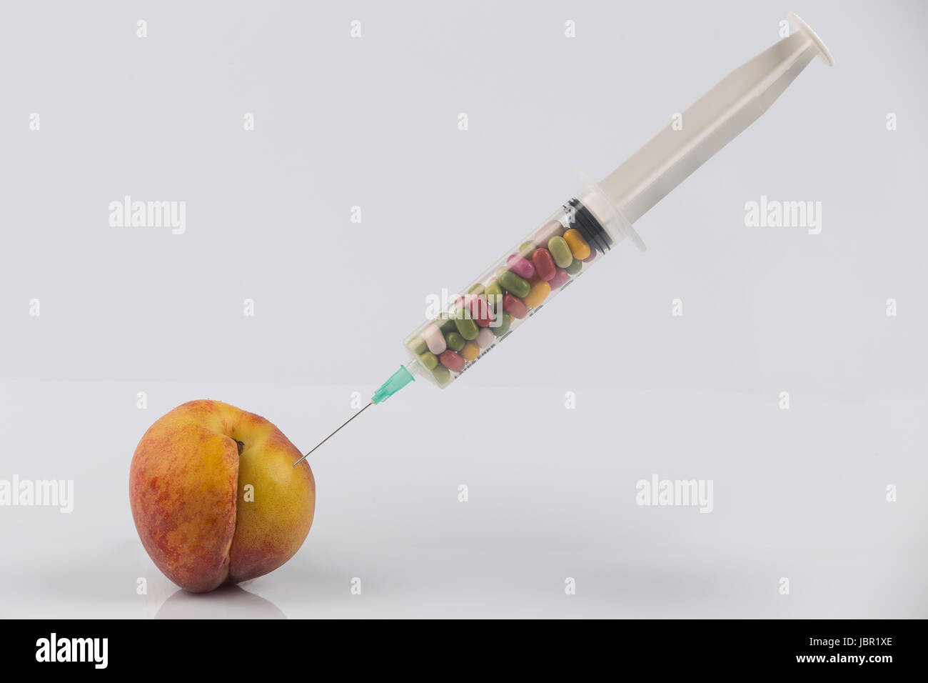 Female menopause and sexual disease metaphor: peach and syringe with ...