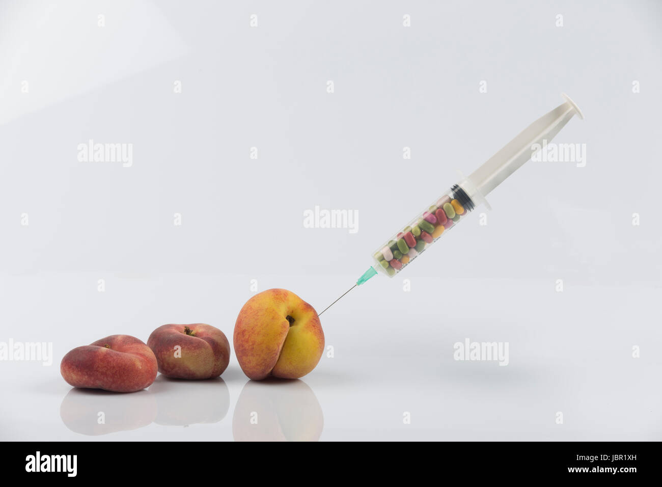 Female menopause and sexual disease metaphor: peaches and syringe with ...