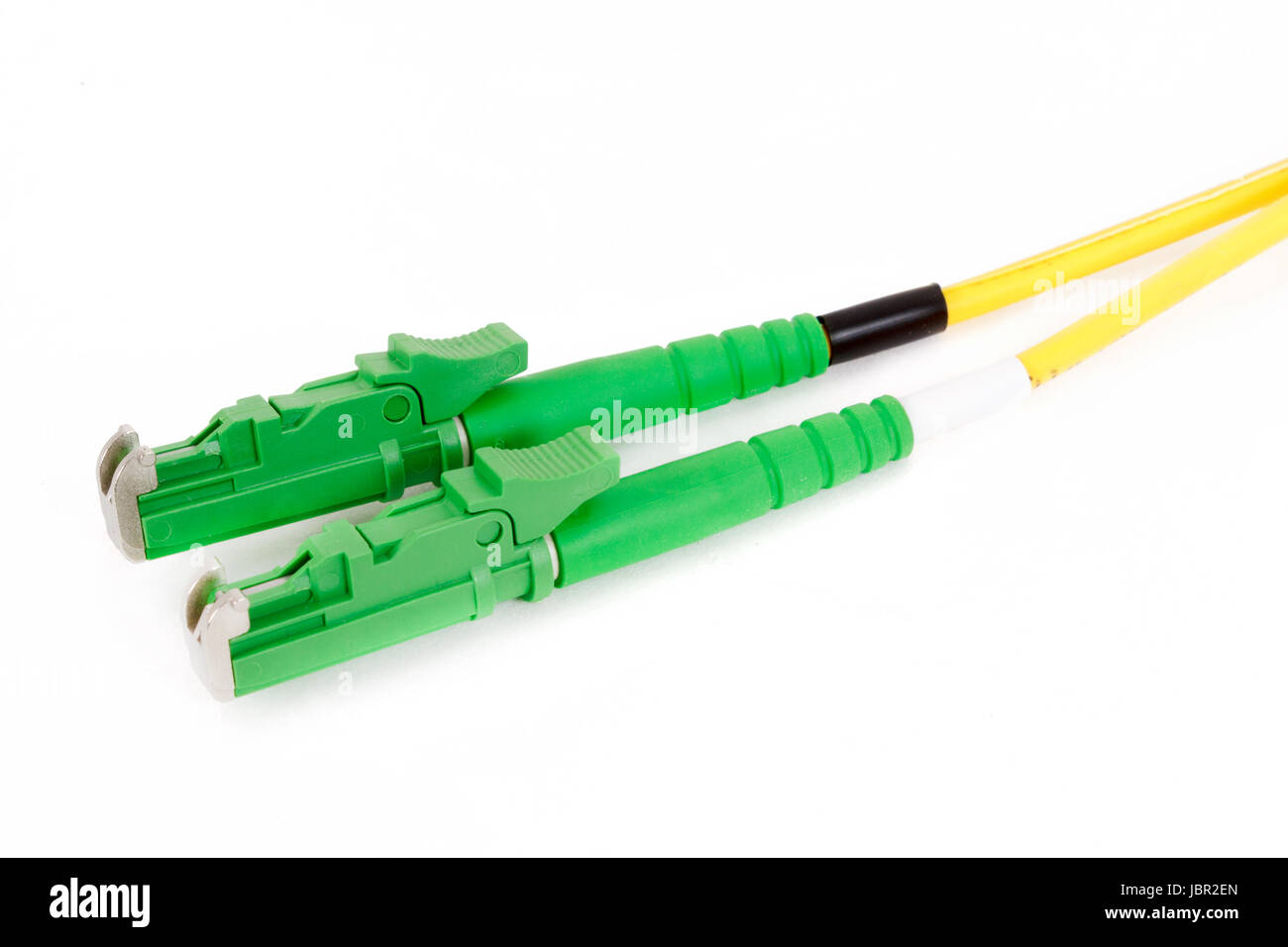 green fiber optic E2000 connector on white background Stock Photo - Alamy