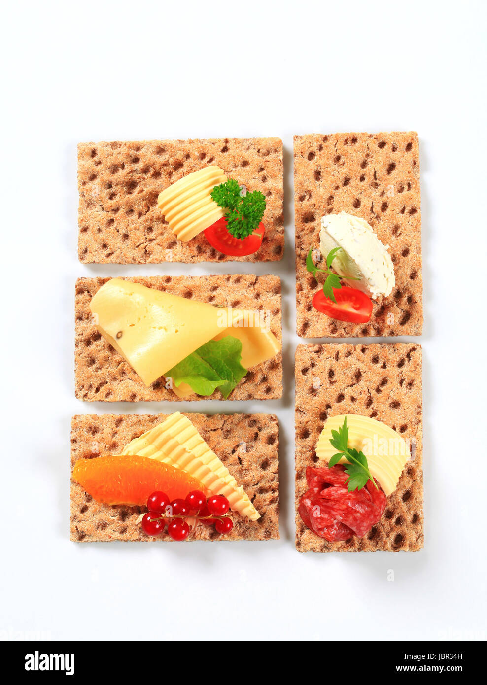 Whole grain crisp bread slices with various toppings Stock Photo - Alamy