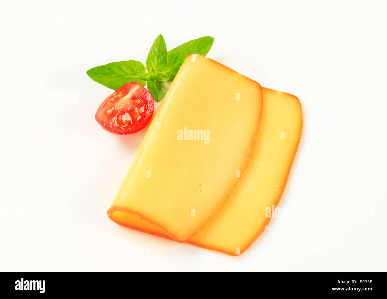 Thin slice of smoked yellow cheese Stock Photo - Alamy