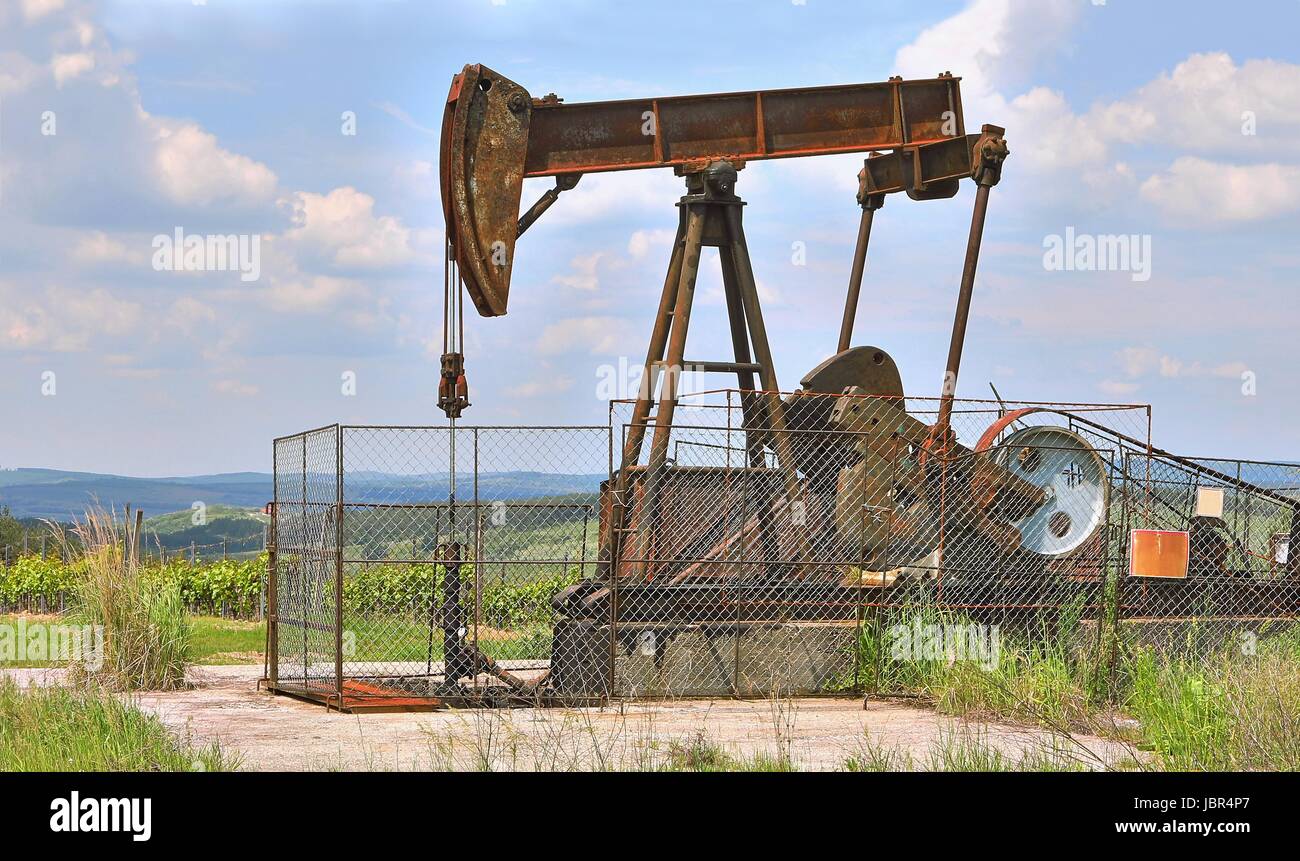 Old rusty oil well on a field Stock Photo - Alamy