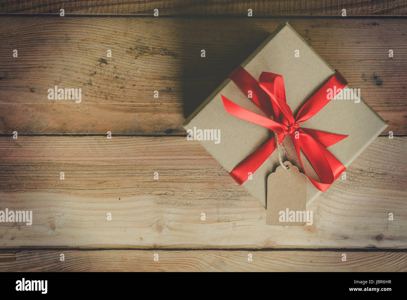 Top view gift box on wood table background with space Stock Photo - Alamy