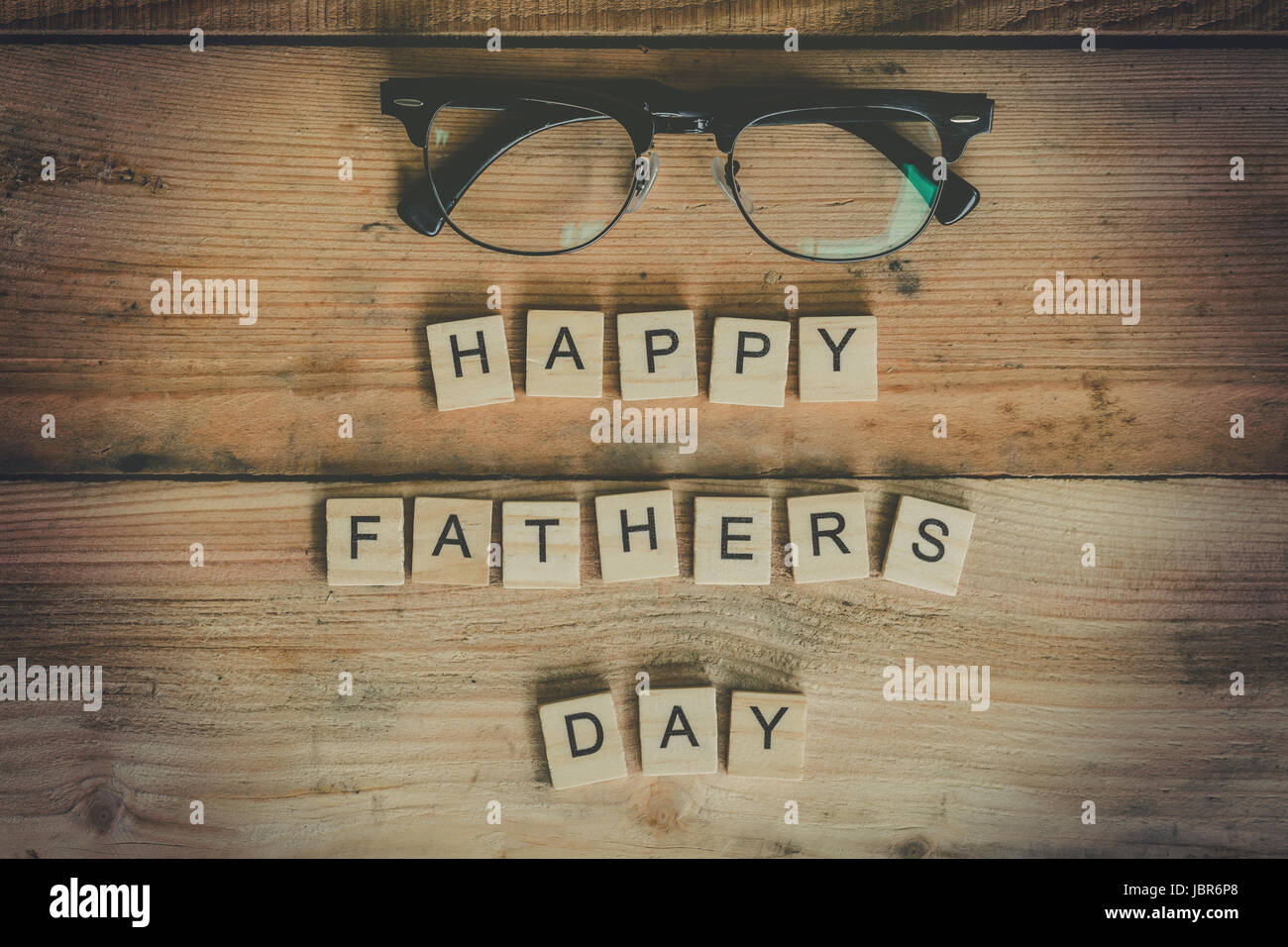 Happy father's day block with glasses on wood background Stock Photo ...