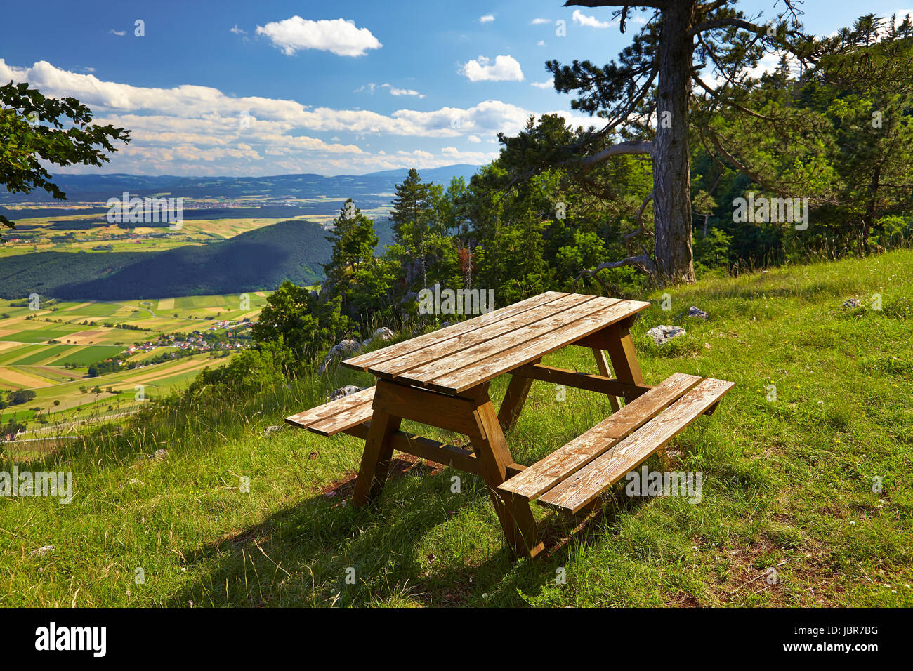 Outdoor bench in a nice mountain area Stock Photo - Alamy