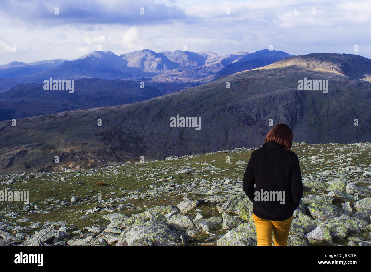 Woman walking alone in mountains hi-res stock photography and images ...