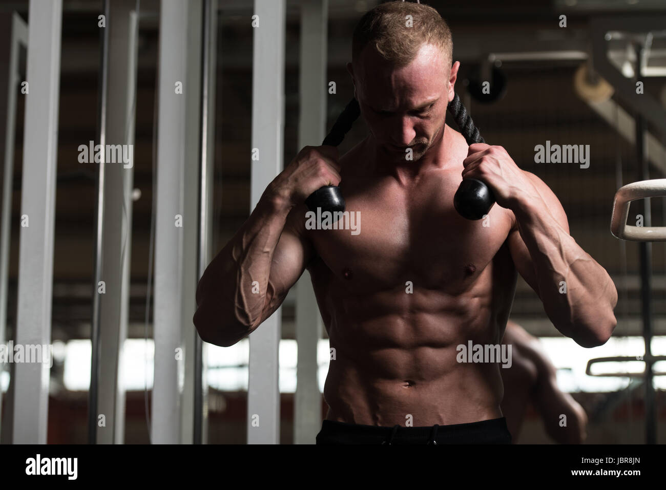 Man Athlete Doing Abs Exercise On Machine With As Part Of Bodybuilding ...
