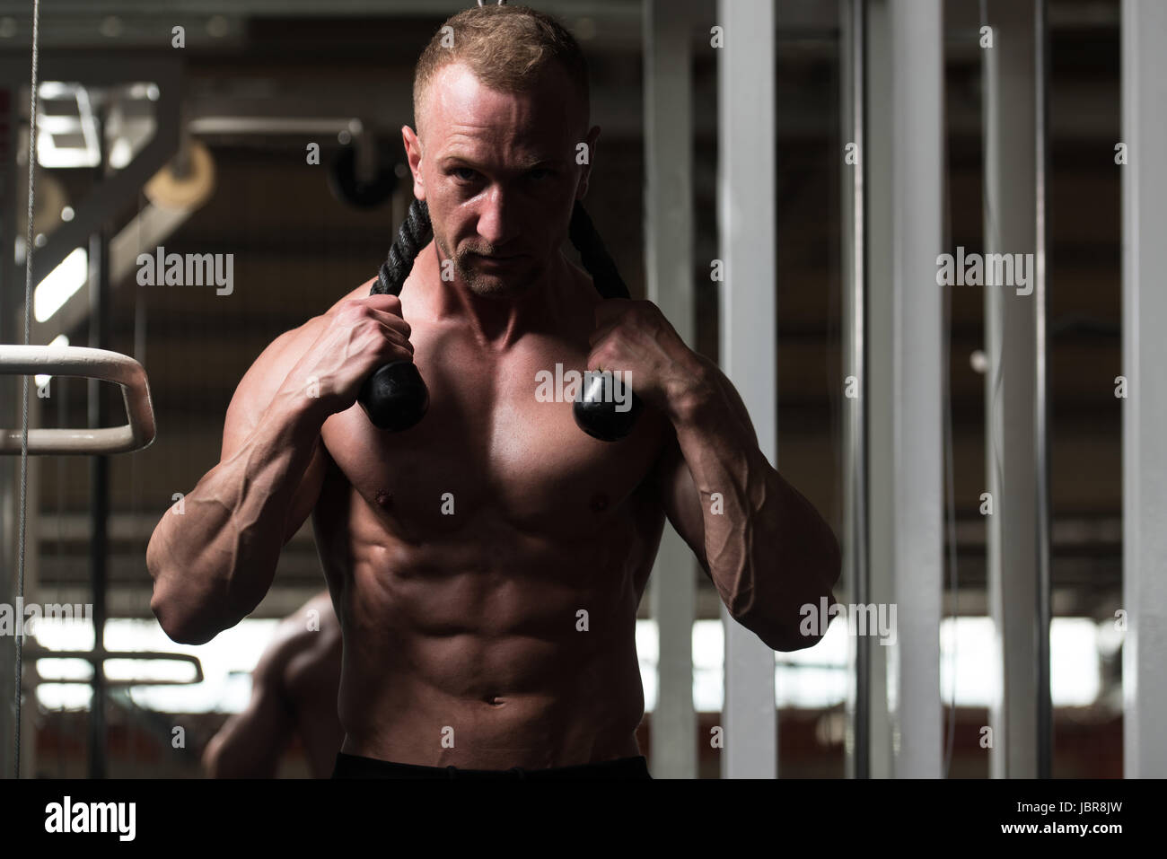 Man Athlete Doing Abs Exercise On Machine With As Part Of Bodybuilding ...