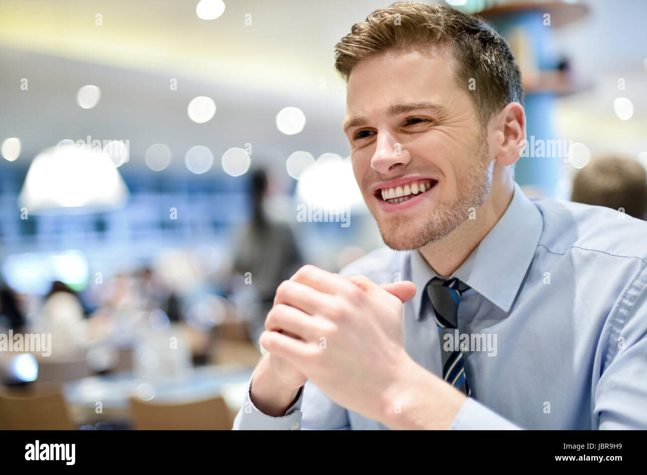 Business guy waiting for his order Stock Photo - Alamy