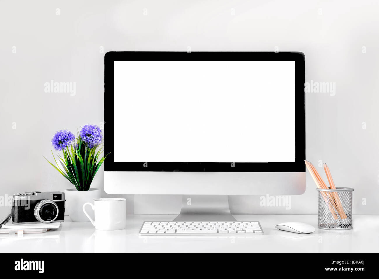 Comfortable workplace with modern desktop computer. Blank screen for ...