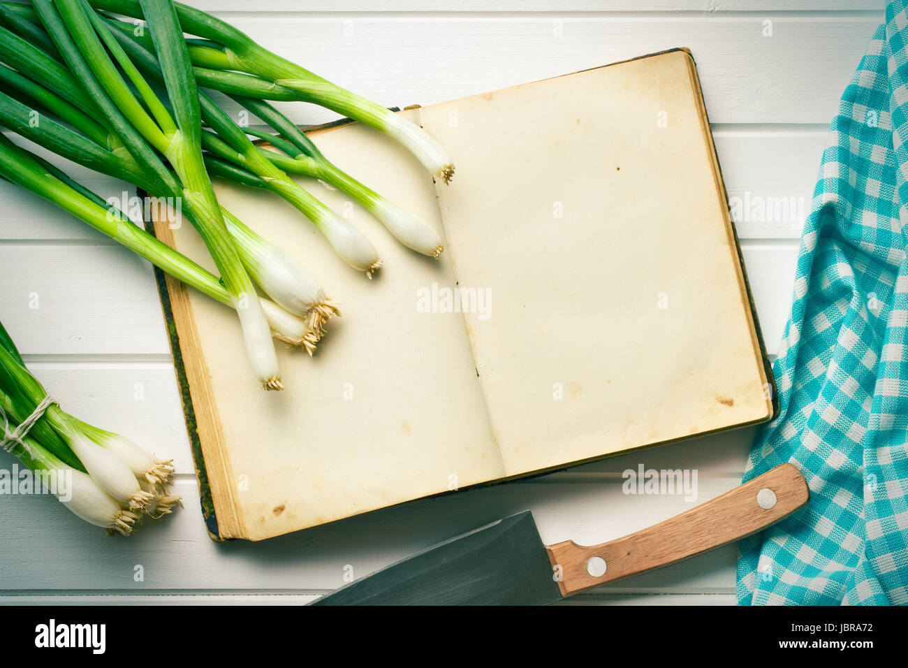the old recipe book with spring onion Stock Photo - Alamy