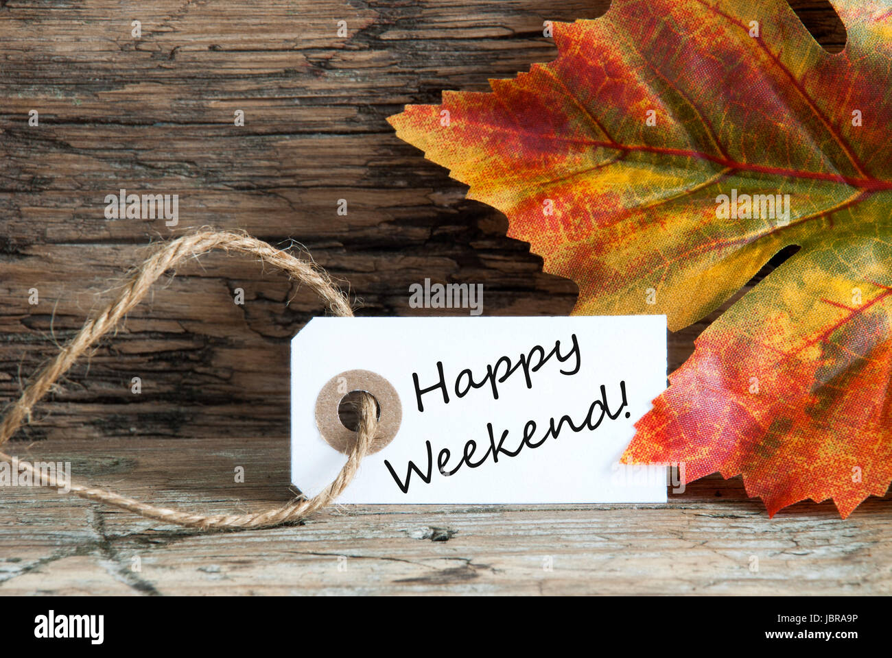 Happy Weekend written on a label with Autumnal Background Stock Photo ...