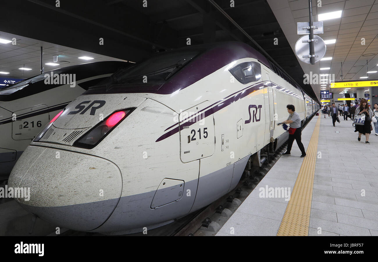 Bullet train SRT Passengers get off an SRT (Super Rapid Train) bullet train at Suseo Station in ...