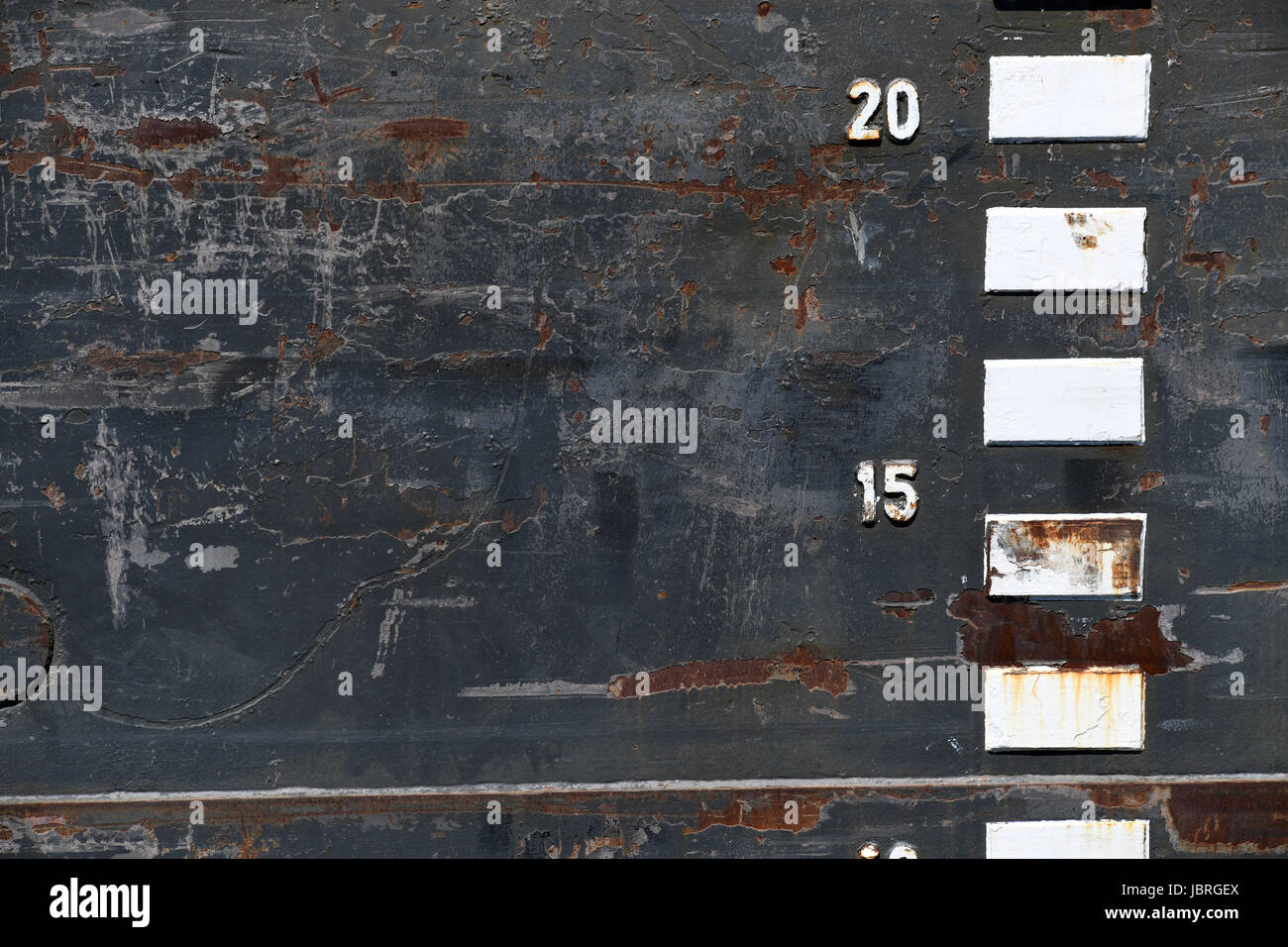 Water depth marks can be seen at the side of a ship at the port of ...