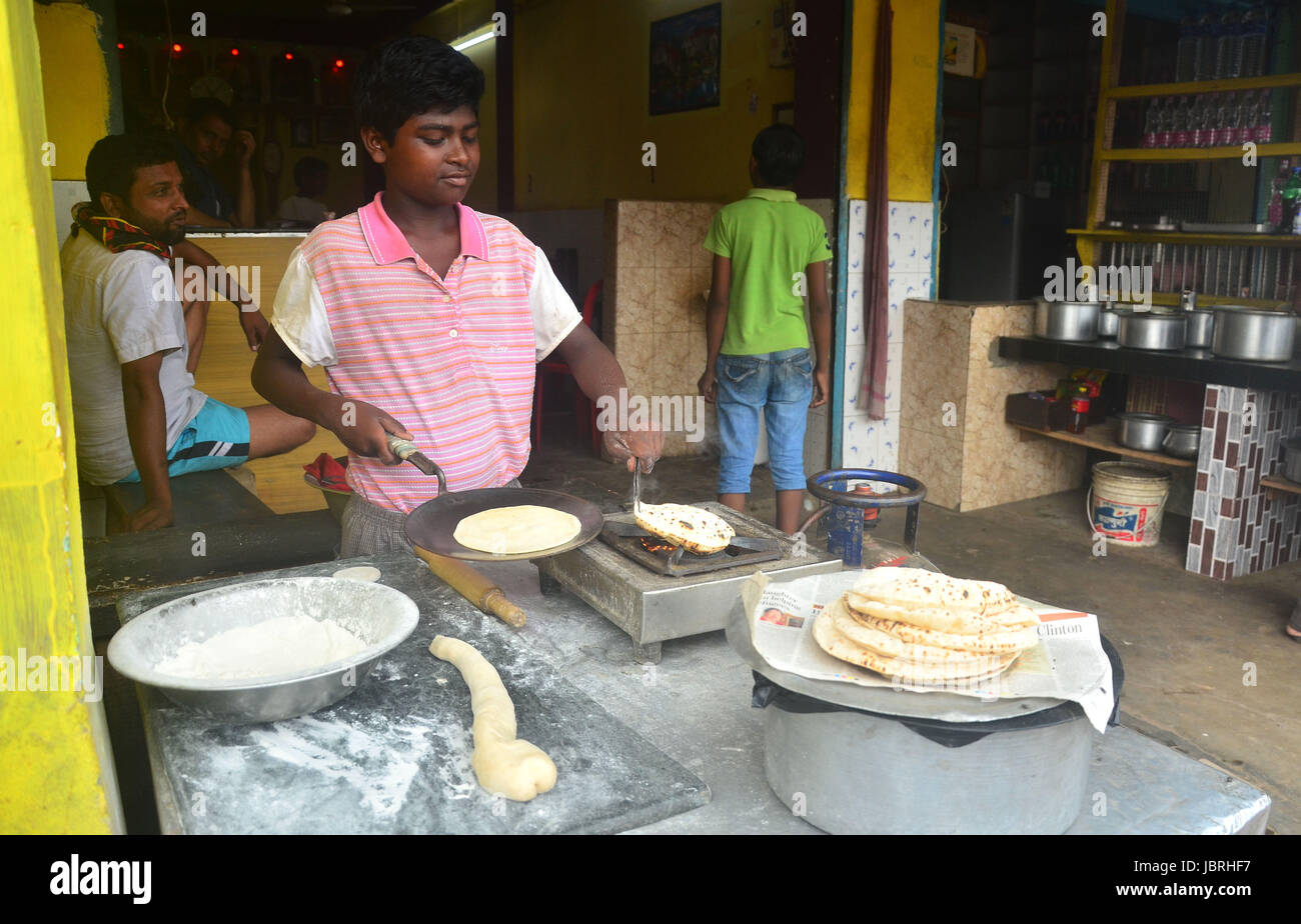 Dimapur, India June 12, 2017: Twelve year-old Indian boy, Vikram baked ...