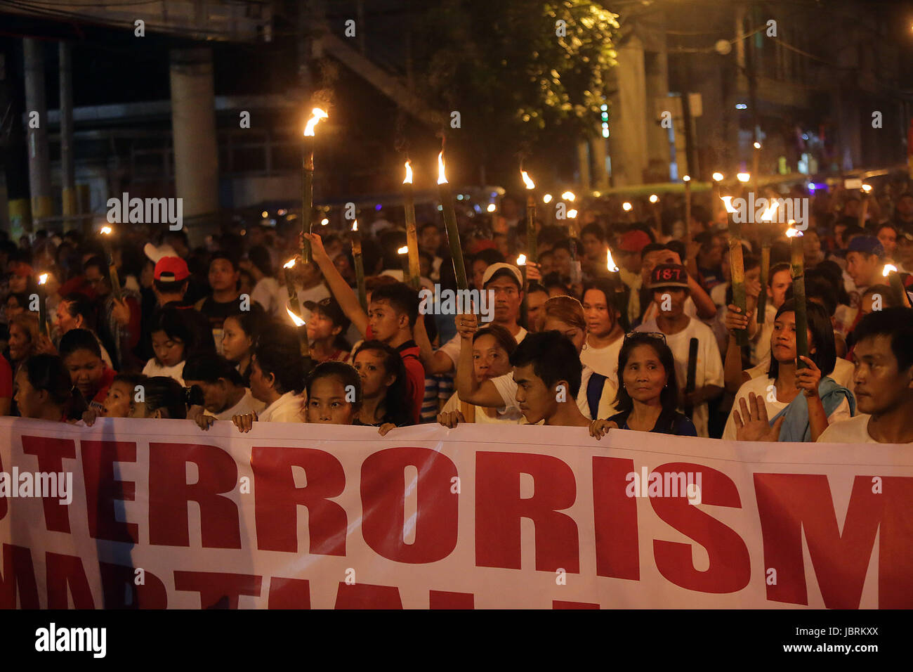 Manila, Philippines. 12th June, 2017. Activists hold placards during a ...