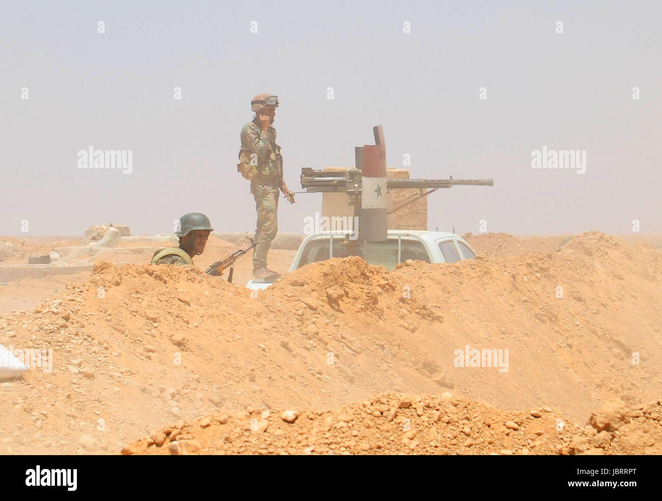 Homs. 12th June, 2017. A Syrian soldier stands on a vehicle in the ...