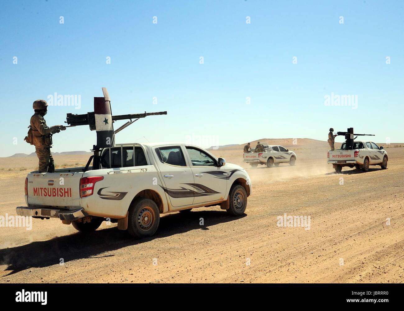 Homs. 12th June, 2017. Syrian military vehicles move in the Syrian ...