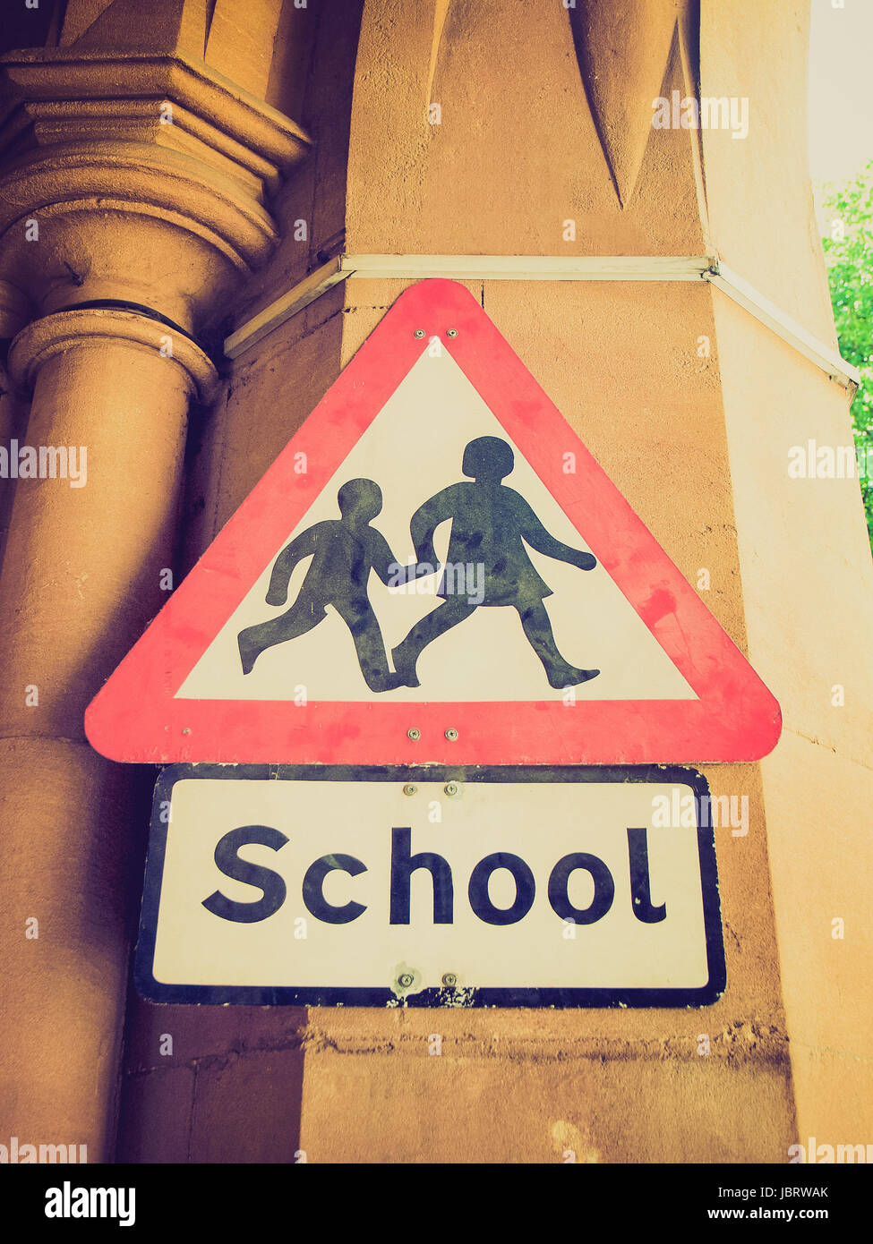 Vintage retro looking A traffic sign of a public school Stock Photo - Alamy