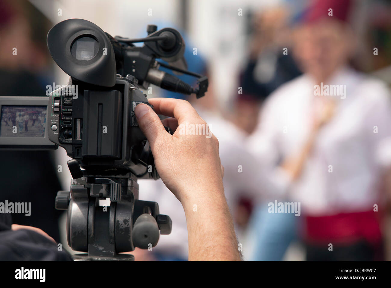 journalist video camera Stock Photo - Alamy