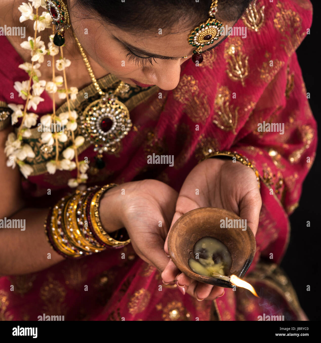 Beautiful Indian female hands holding diya oil lamp, celebrating diwali ...