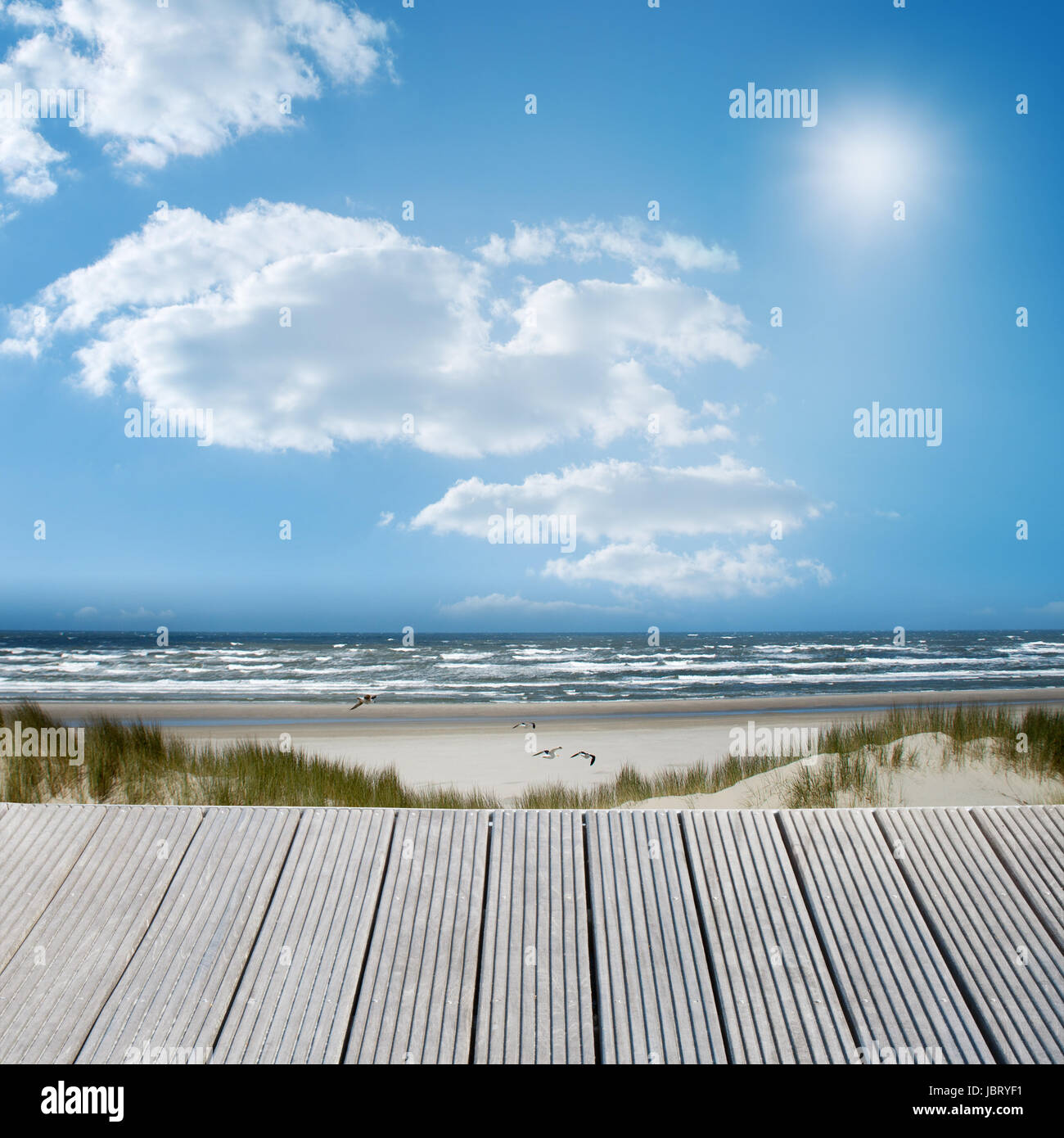 Landscape of a wooden jetty overlooking the sea with a sunny background ...