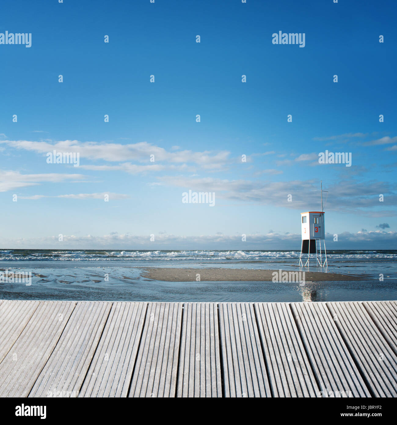 Landscape of a wooden jetty overlooking the sea with a sunny background ...