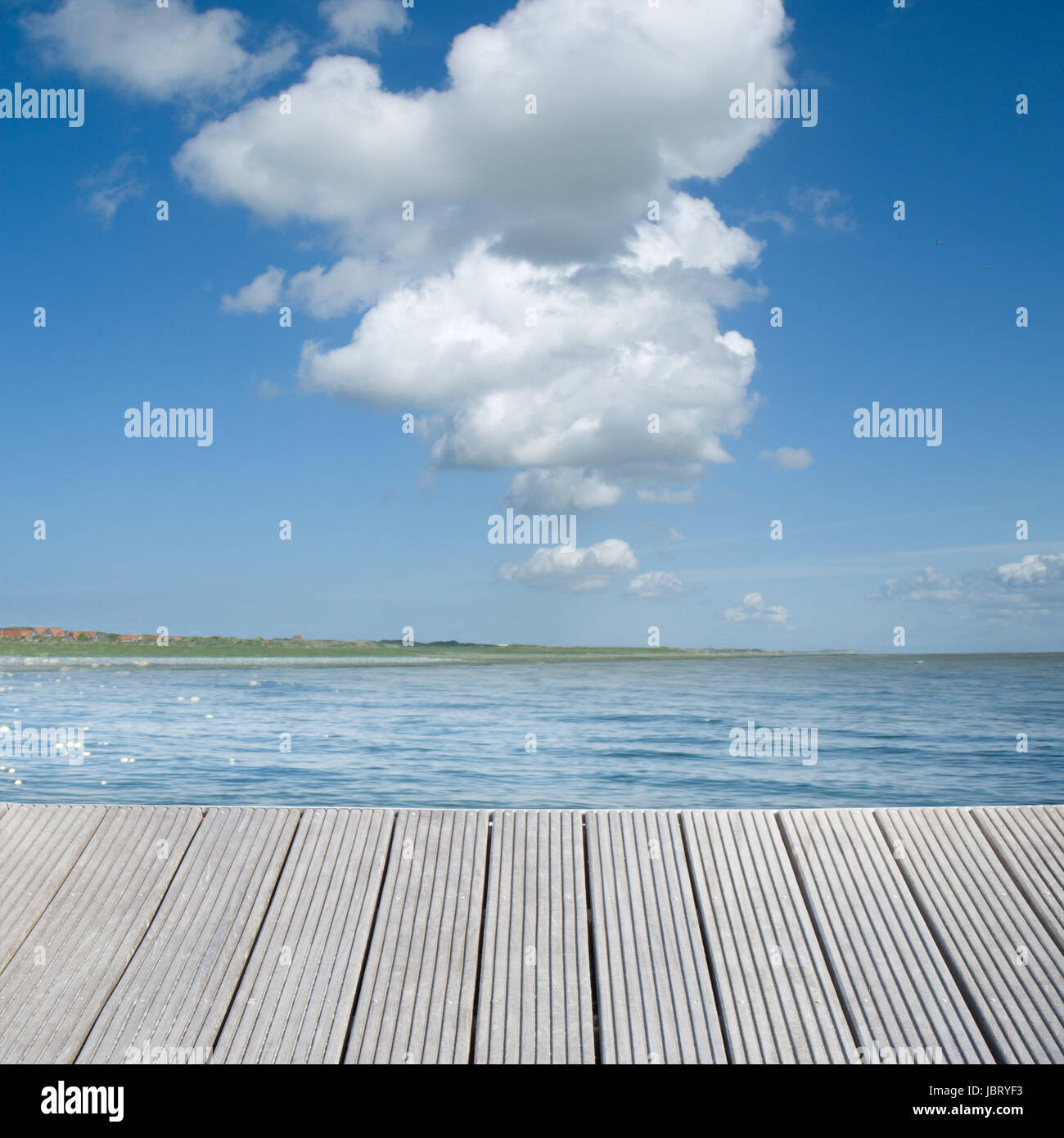 Landscape of a wooden jetty overlooking the sea with a sunny background ...
