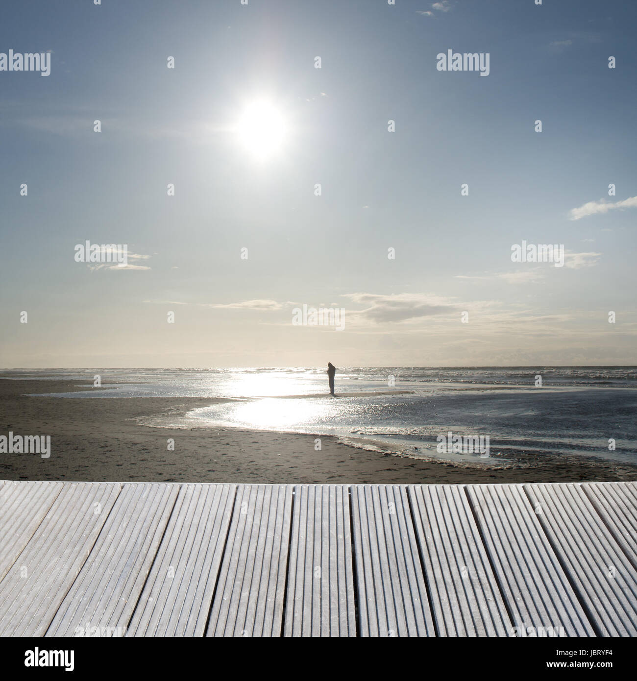 Landscape of a wooden jetty overlooking the sea with a sunny background ...