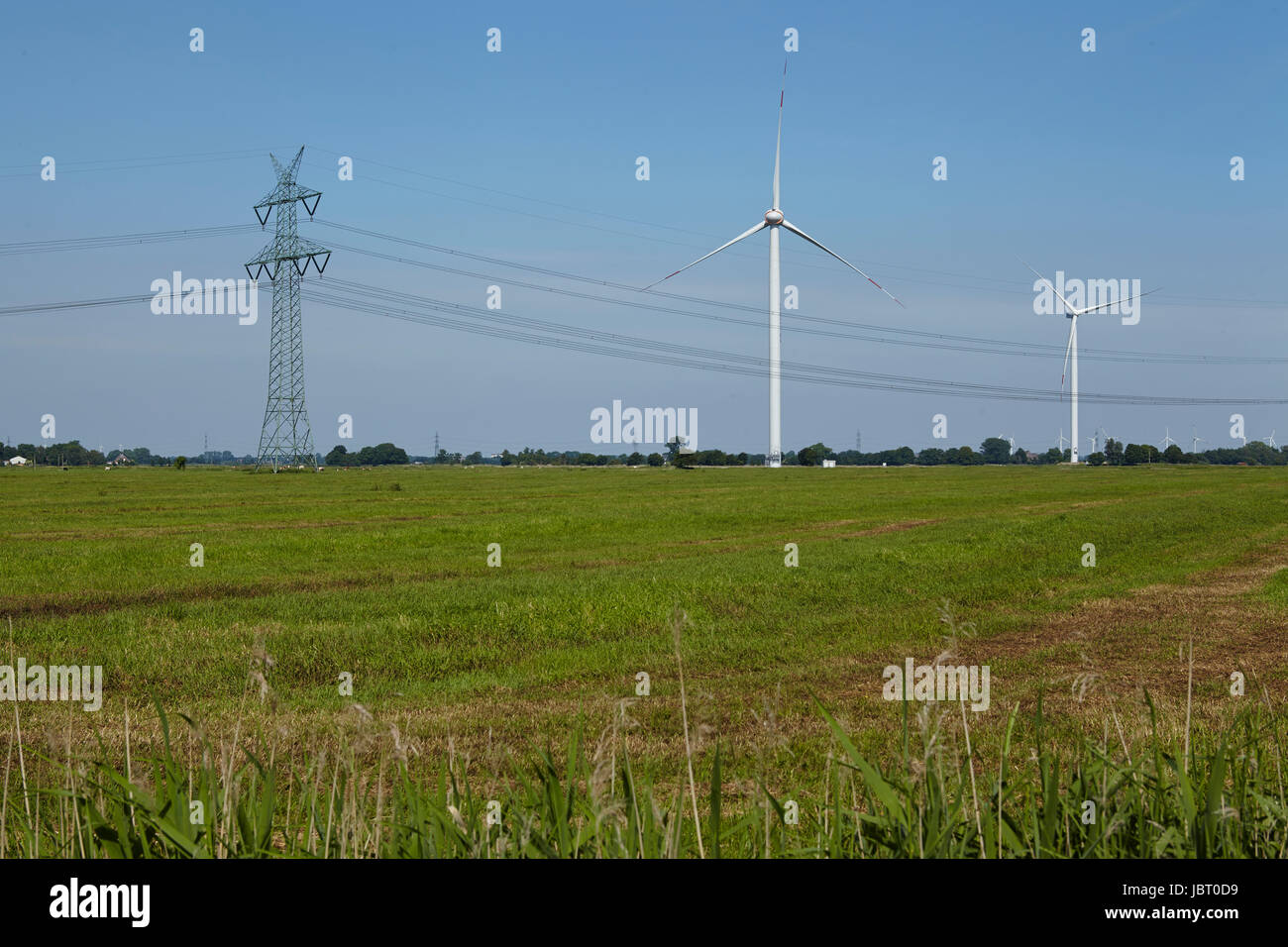 Landscape with wind turbines, power pole and power lines taken at ...
