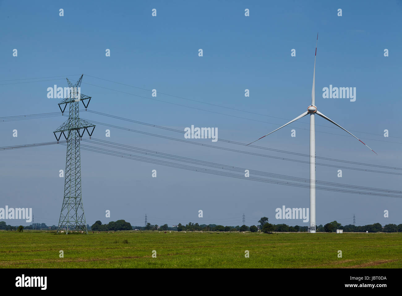 Landscape with wind turbine, power pole and power lines taken at ...