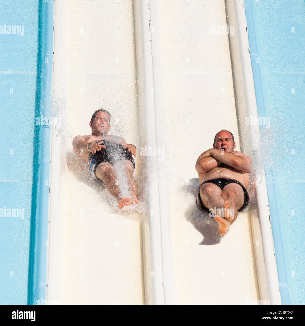 People having fun, sliding at water park Stock Photo - Alamy