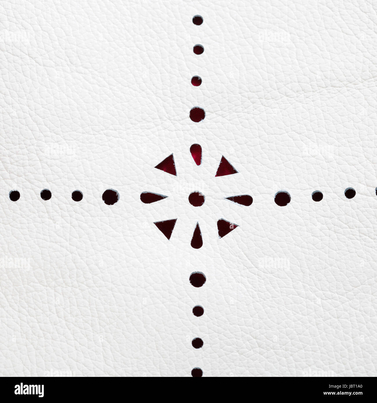 perforated pattern on white leather close up Stock Photo - Alamy