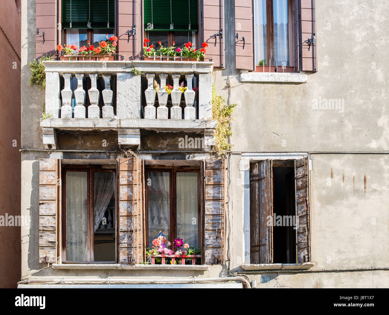 Venetian windows with flowers Stock Photo - Alamy