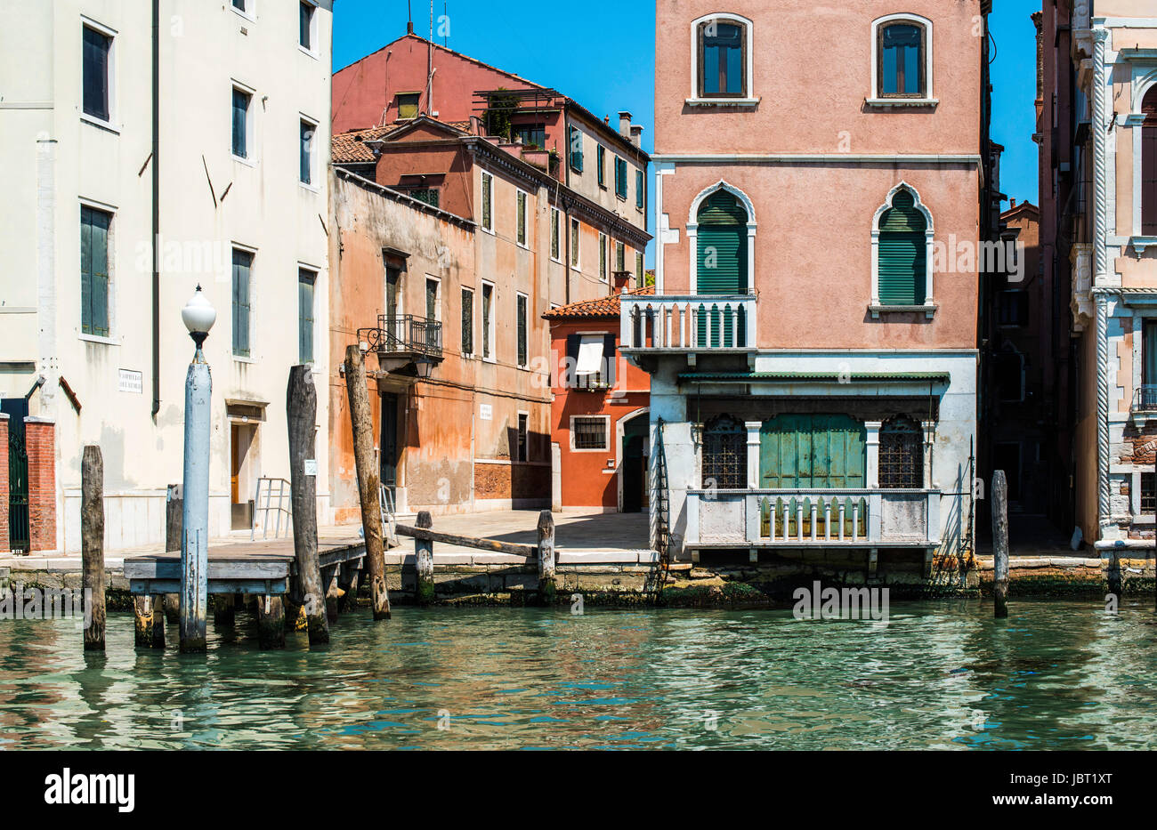 Ancient buildings in Venice. Boats moored in the channel. View from the ...
