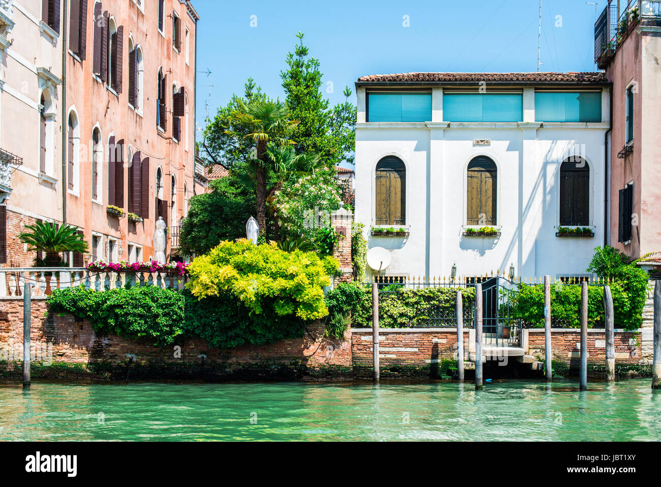 Ancient buildings in Venice. Boats moored in the channel. View from the ...