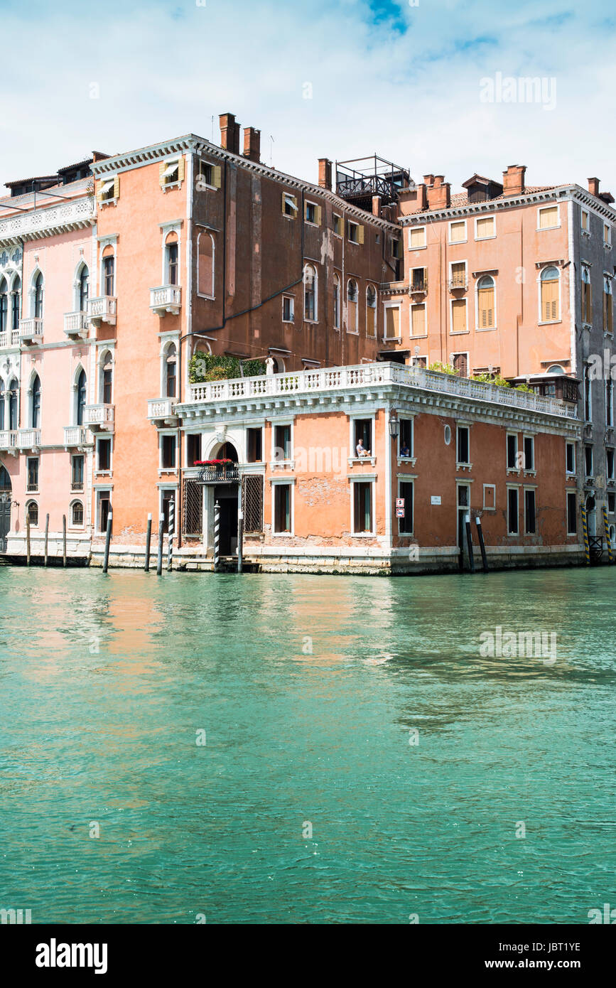 Ancient buildings in Venice. Boats moored in the channel. View from the ...